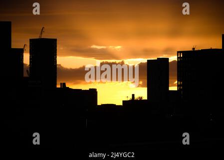18th April, 2022. A dramatic sunset amongst tower blocks on the evening ...
