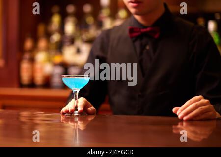Japanese bartender serving a drink Stock Photo - Alamy