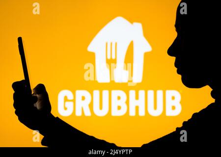 In this photo illustration the Grubhub Inc. logo seen in the background ...