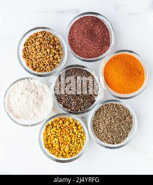 Various healthy superfoods powder in bowls Stock Photo - Alamy