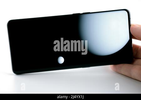 Smartphone with the NFT Merge digital art by Murat Pak. The most ...