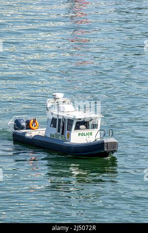 A Miami-Dade County Police Boat patrols the water around the Port of ...
