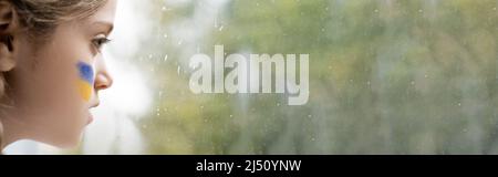 Raindrops with ukraine flag background, raindrops on glass with colors ...