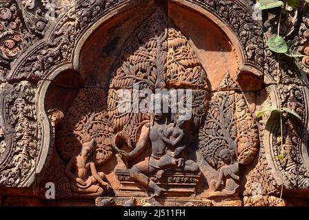Cambodia: The Hindu god Shiva sits above the demon Kala, Banteay Srei ...