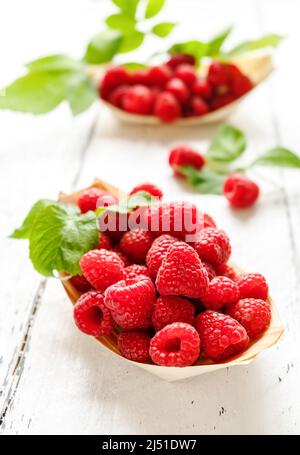 Raspberries in plates close-up. Raspberries in a bowl Stock Photo - Alamy