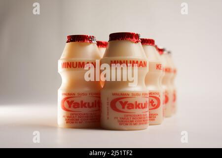 group healthy drink yakult on white background Stock Photo - Alamy