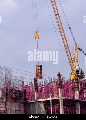 The pink scaffolding on the building under construction Stock Photo - Alamy