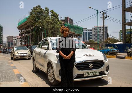 Taxi driver stands in front of his taxi, smiling at camera Stock Photo ...