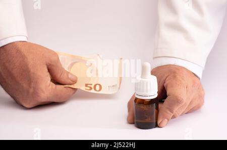 Two hands with cannabis and money. The concept of selling marijuana ...