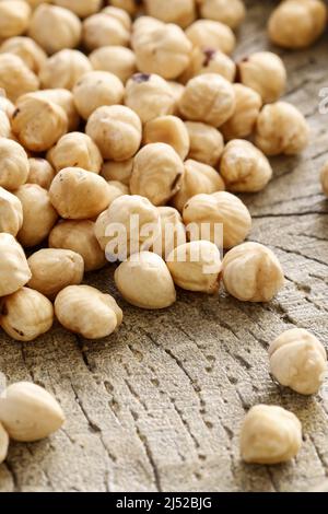 Hazelnuts on rough wooden background. Healthy food Stock Photo - Alamy