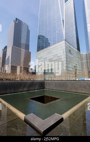 One of the two reflecting pools at the World Trade Center site with the ...