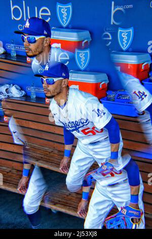 Los Angeles Dodgers' Mookie Betts, left, wipes San Diego Padres ...