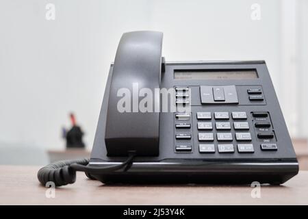 Landline ip phone stands in the office, isolated on a white background ...