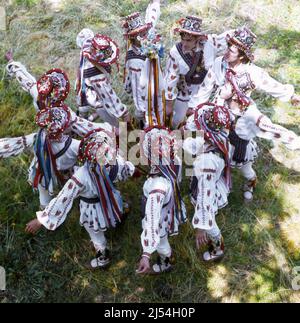 Group of young Romanian males performing a traditional caroling for the ...
