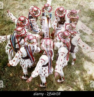 Group of young Romanian males performing a traditional caroling for the ...