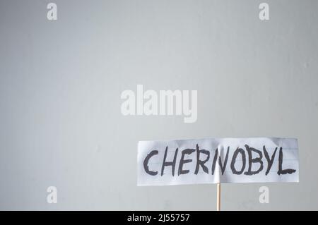 Chernobyl,word written on a cut paper,soured white background and copy ...