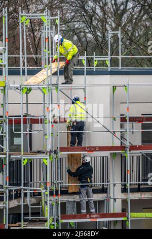 Construction scaffolding on residential building facade during ...