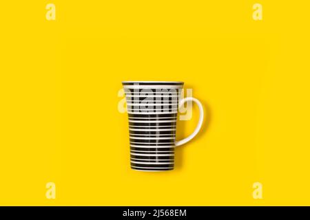 Black ceramic coffee mug with yellow batman superhero logo isolated on ...
