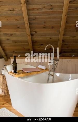 Bathroom accessories on a wooden shelf, toothbrushes, body brush and ...