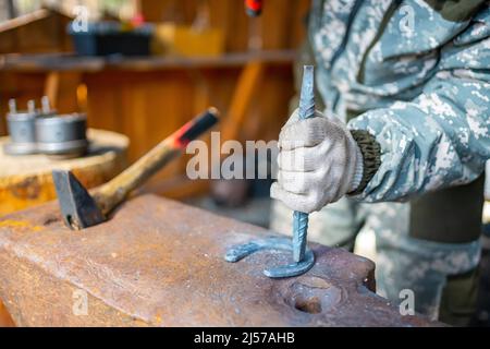 Poker work with tool - close up pyrography Stock Photo - Alamy