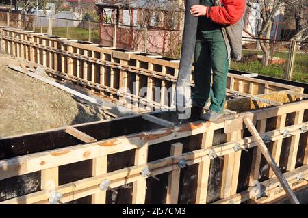 Building T-Shaped Concrete House Foundation with Slabs and iron Bars ...