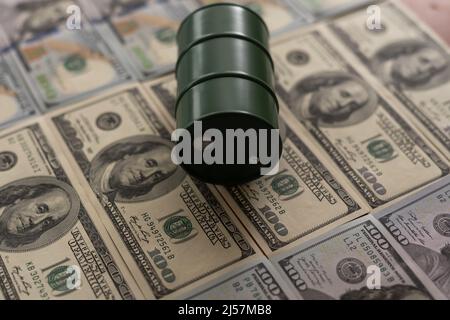 the barrel of oil of one hundred US dollar bills Stock Photo - Alamy