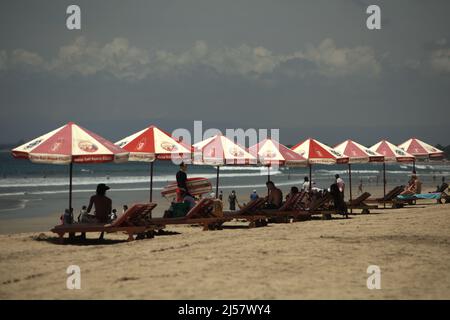 Sunshades for visitors on Kuta beach in Kuta, Badung, Bali, Indonesia ...