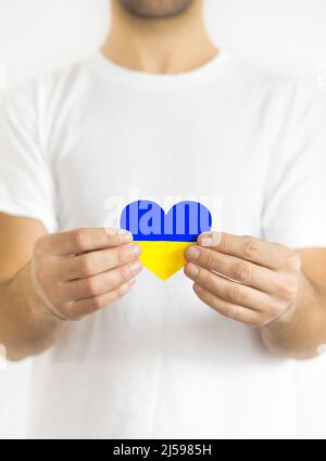 Love Ukraine concept. hands in heart form painted in Ukraine flag color ...