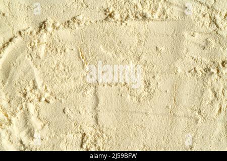 Beige background made of whey protein powder - healthy nutritional ...