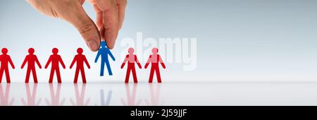Recruitment concept with hand picking the best employee Stock Photo - Alamy
