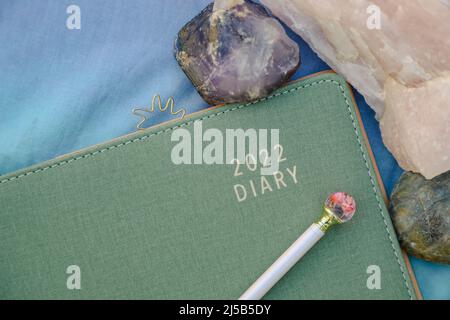 Flat lay image featuring 2022 diary with amethyst quartz, rock crystals ...