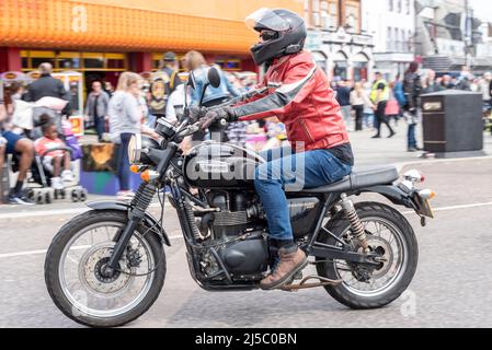A side on view of a black Triumph Speed Triple motorcycle parked up on ...