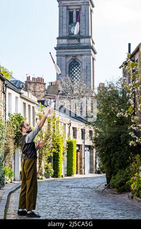 Circus act juggler, Robert Gallagher-Lyall practising juggling clubs ...