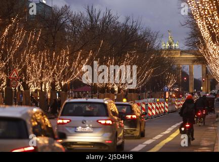 Cars drive through the Christmas decorated Gediminas Avenue in Vilnius ...