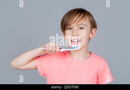 Joyful child shows toothbrushes. Little boy cleaning teeth. Dental ...
