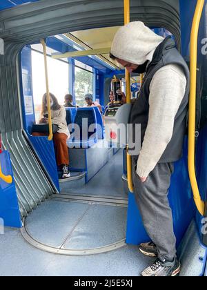 Drunk man standing in a tram train, Lyon, France Stock Photo - Alamy