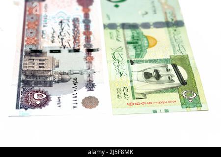 Obverse sides of an old Saudi Arabia 10 ten riyals banknote with 10 LE ...