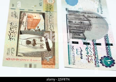 Obverse sides of an old Saudi Arabia 10 ten riyals banknote with 10 LE ...