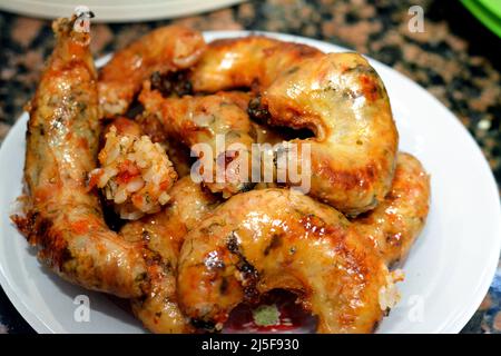 Arabic cuisine; Egyptian traditional sausage with onions, bell peppers ...