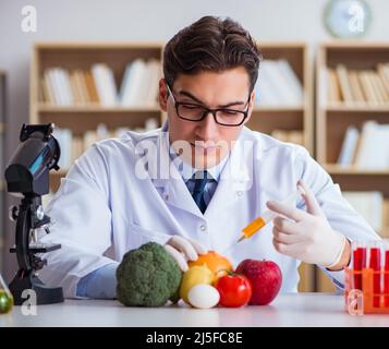 The man doctor checking the fruits and vegetables Stock Photo - Alamy