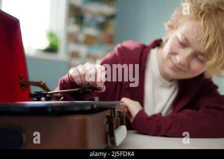 Teenage Girl Playing Vinyl Records On Record Player At Home In Bedroom ...