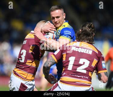 Luke Yates of Warrington Wolves is tackled during the Betfred Super ...