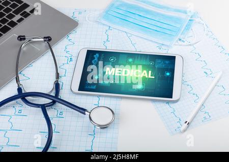 Tablet pc and medical stuff Stock Photo - Alamy