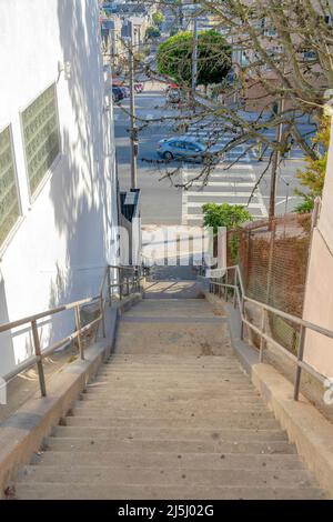 Outdoor staircase near the side walk and intersection with crosswalk at ...