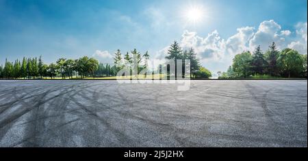 Asphalt road platform and beautiful blue sky with white clouds scene ...