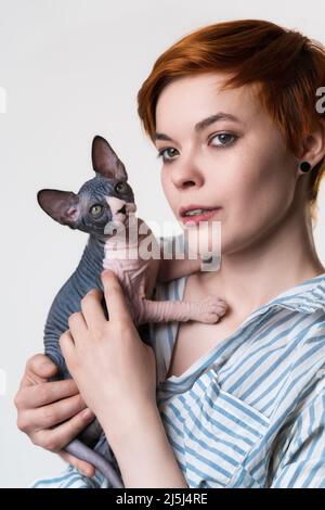 Beautiful redhead woman holding canadian dollars and canada flag ...