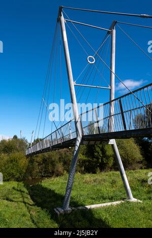 Suspension footpath bridge over the river wye at The Biblins near ...