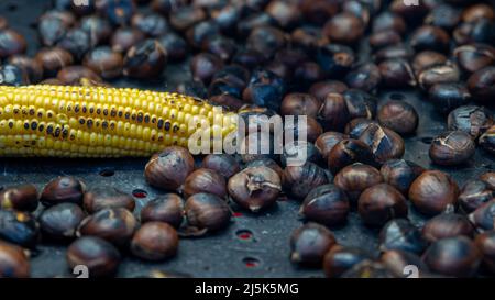 Grilled chestnut and cob. Barbecue with charcoal fire Stock Photo - Alamy