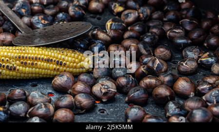 Grilled chestnut and cob. Barbecue with charcoal fire Stock Photo - Alamy