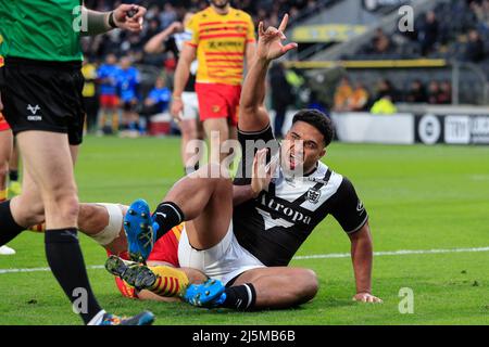 Chris Satae #10 of Hull FC breaks through the Leeds defence to race to ...